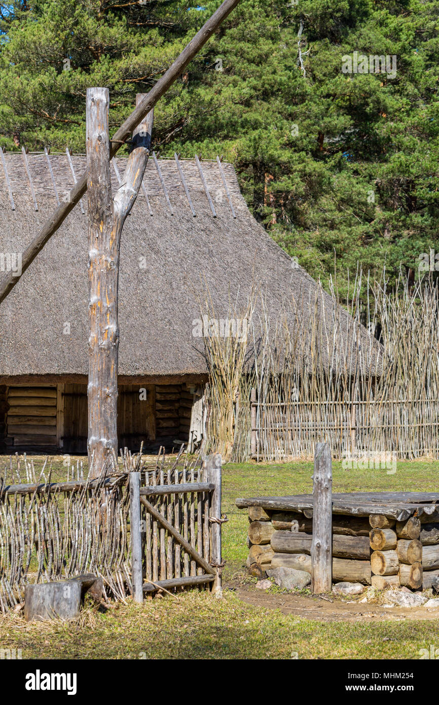 Traditional wooden country hut and well Stock Photo - Alamy