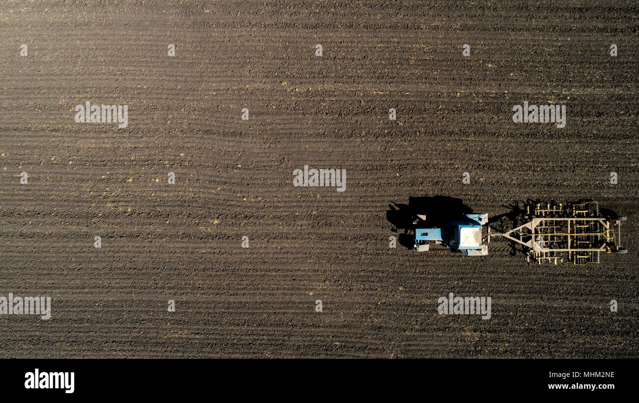 Aerial view of a tractor on a field Stock Photo - Alamy