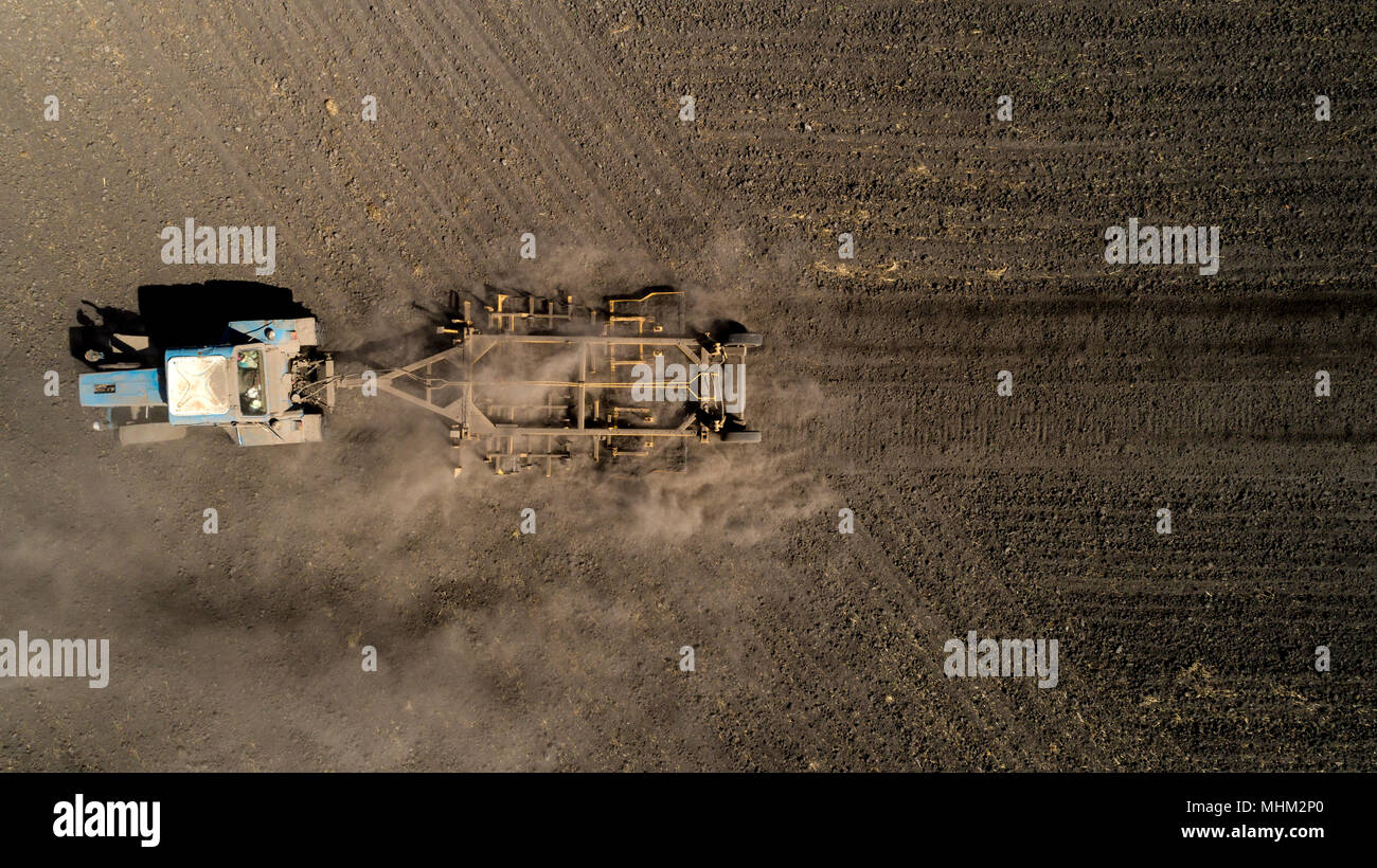 Aerial view of a tractor on a field Stock Photo - Alamy