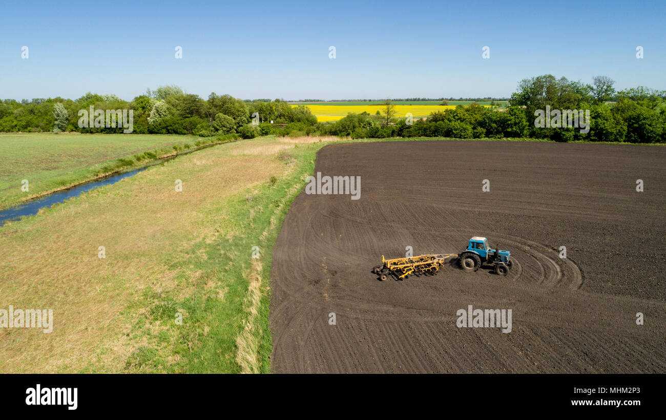 Aerial view of a tractor on a field Stock Photo - Alamy