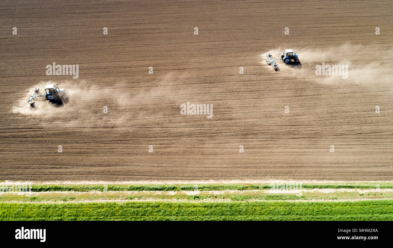Aerial view of two tractors on a field Stock Photo - Alamy