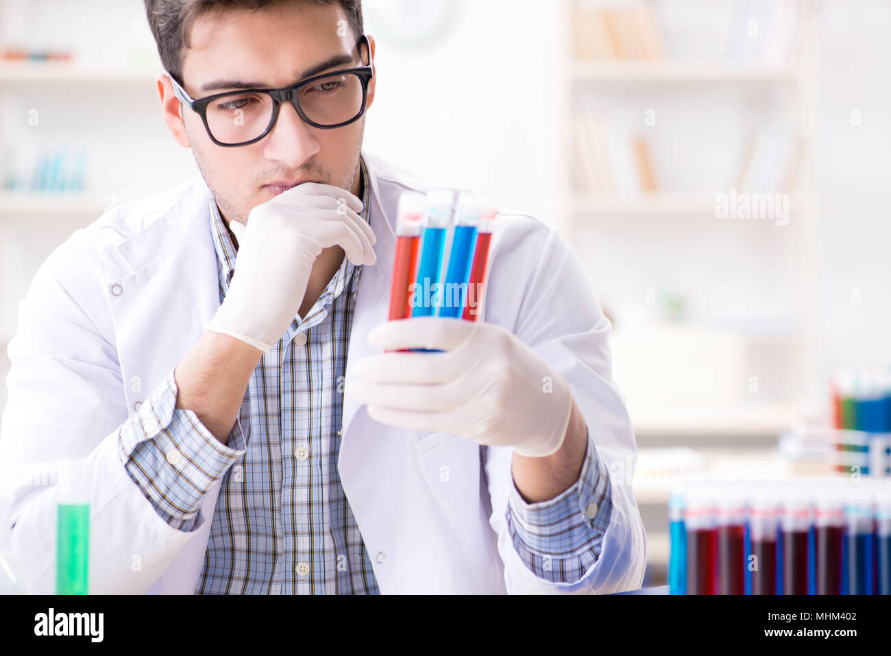Chemistry student doing chemical experiments at classroom activity ...