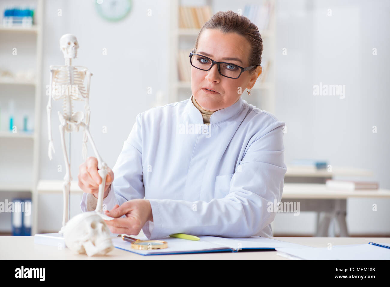 Woman doctor studying human skeleton Stock Photo - Alamy