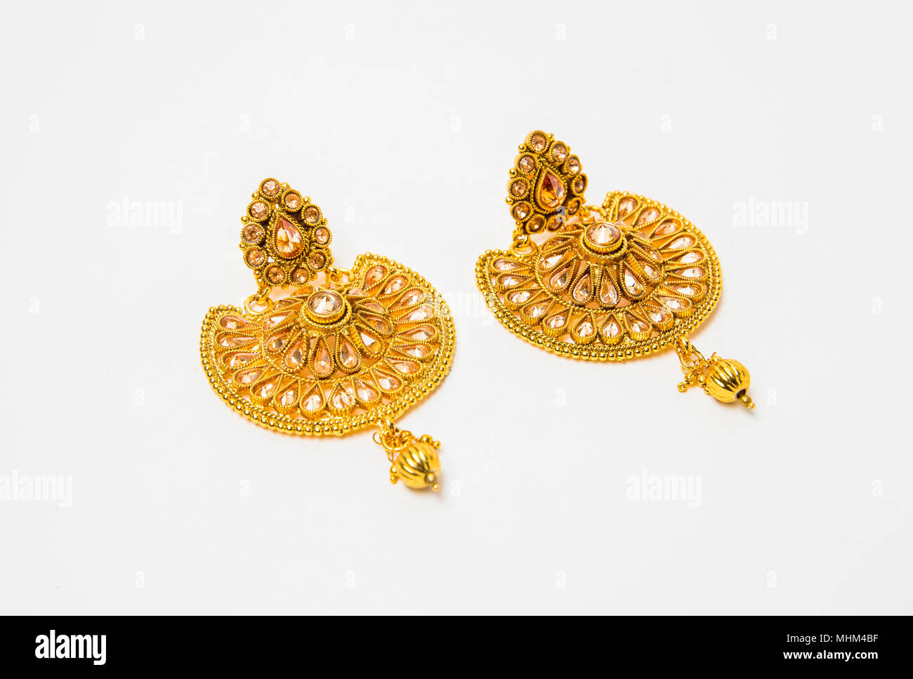 Decorative golden ear rings Stock Photo - Alamy