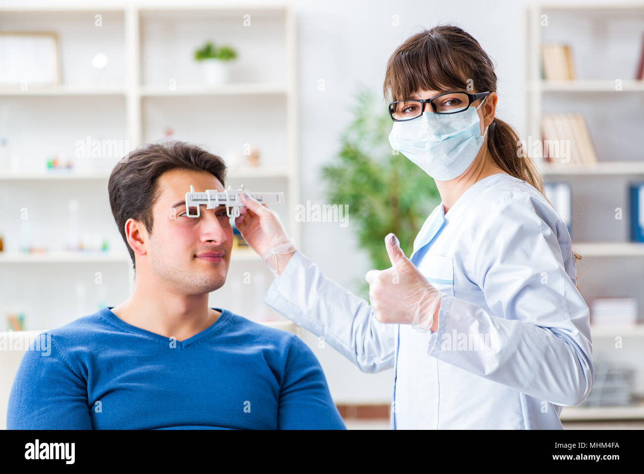 Ophthalmologist is checking up patient in eye doctor hospital Stock ...