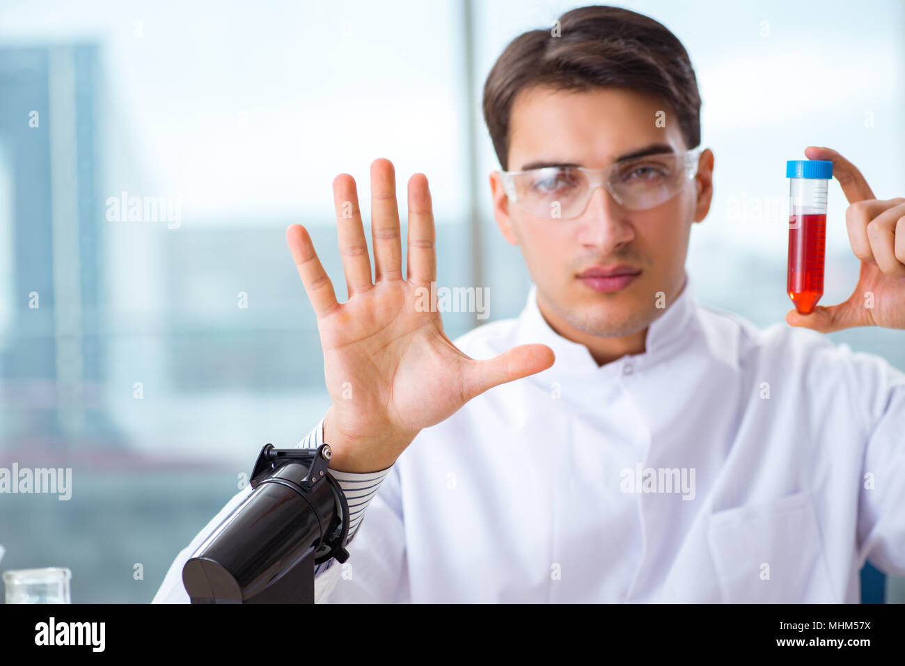 Man doctor checking blood samples in lab Stock Photo - Alamy