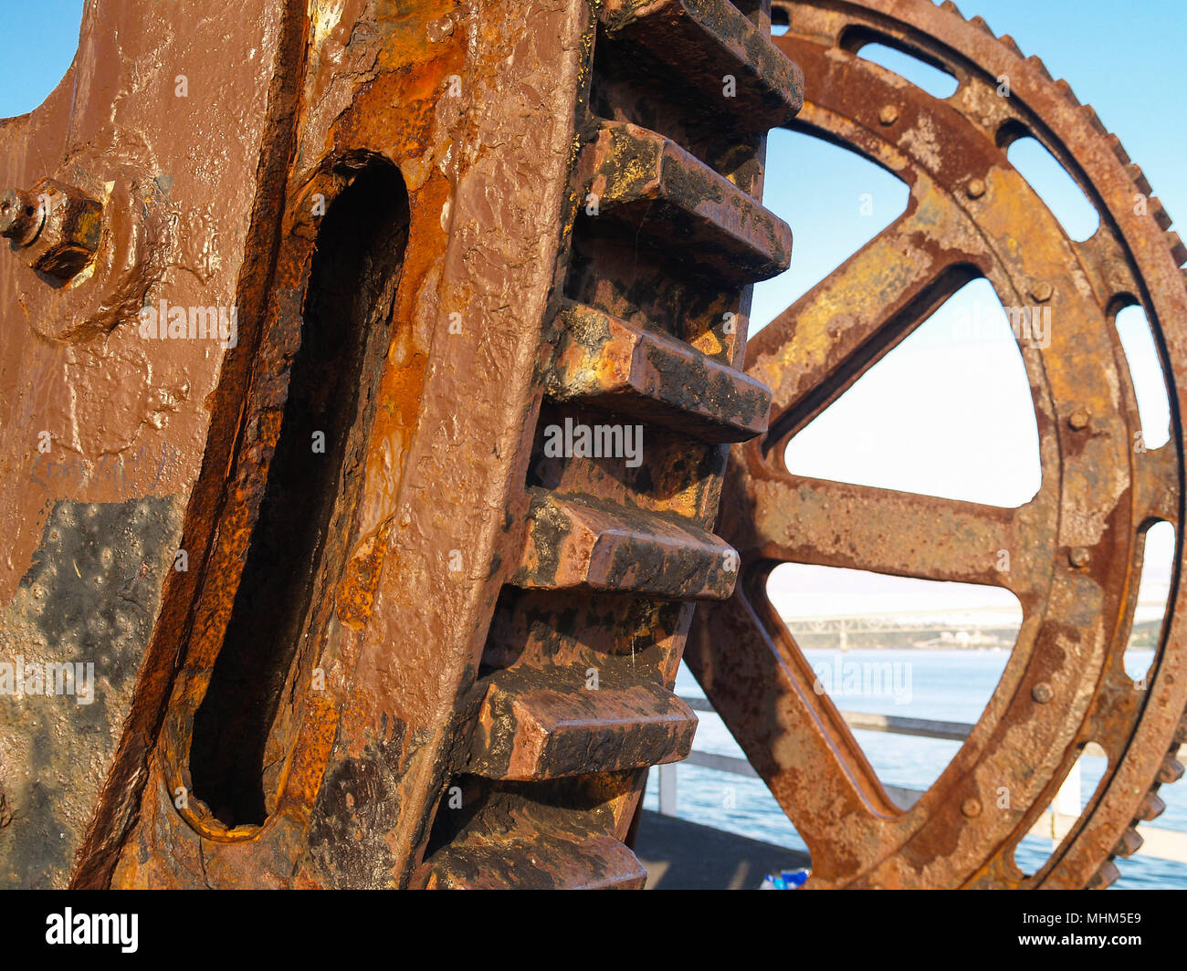 Old dredge wheels heavy and strong iron teeth Stock Photo - Alamy