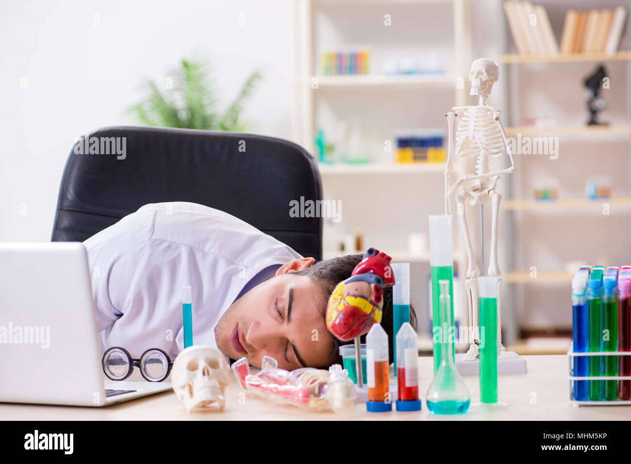 Funny doctor having fun in hospital lab Stock Photo - Alamy