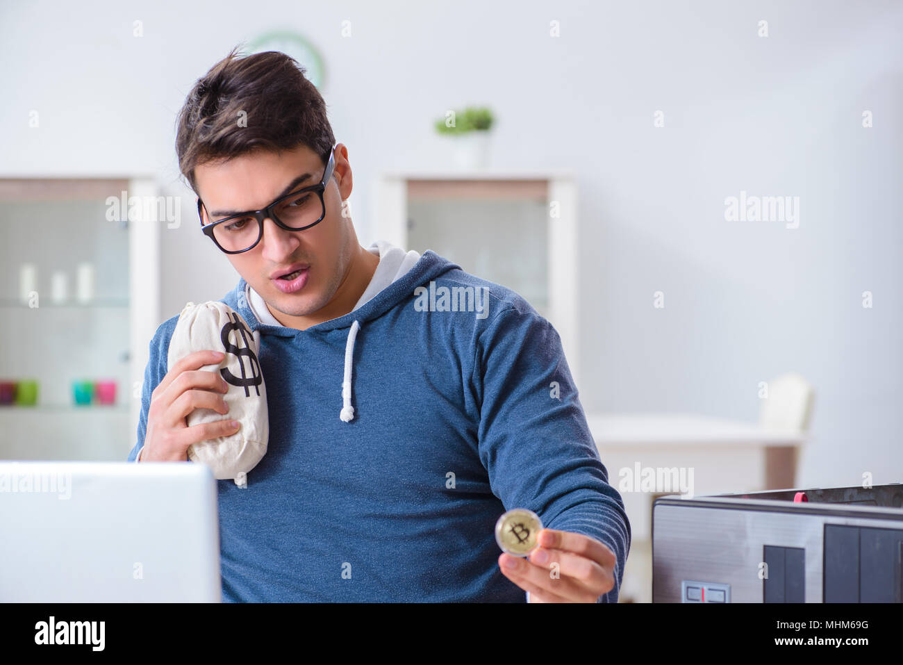 Young businessman bitcoin money bag hi-res stock photography and images ...