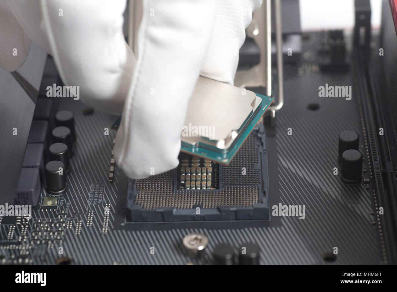 Computer Technician Installing Cpu Into Motherboard Close Up Stock