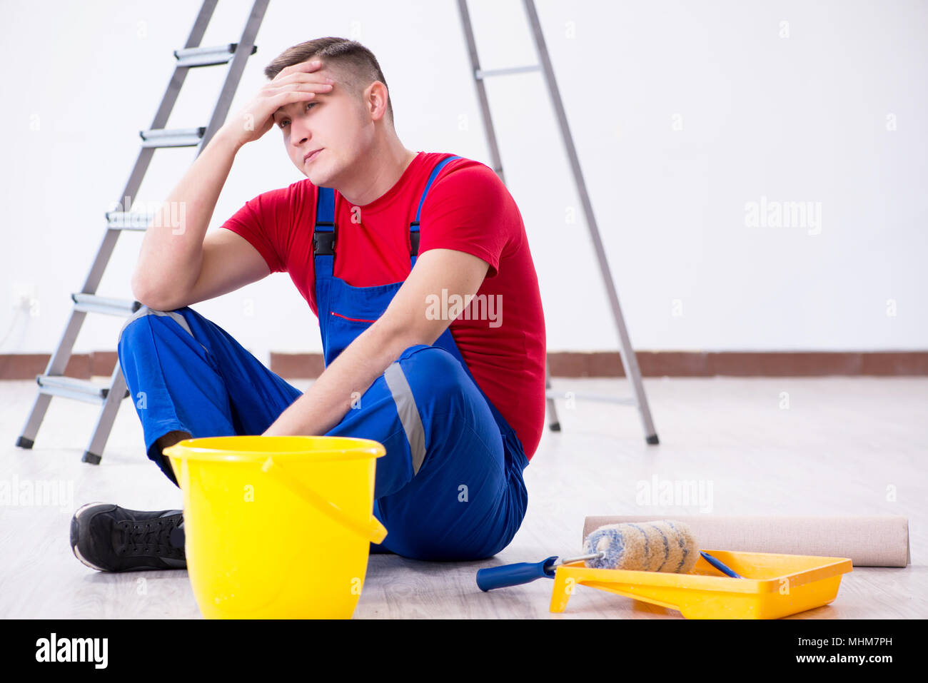 Male painter preparing for painting job at construction site Stock ...