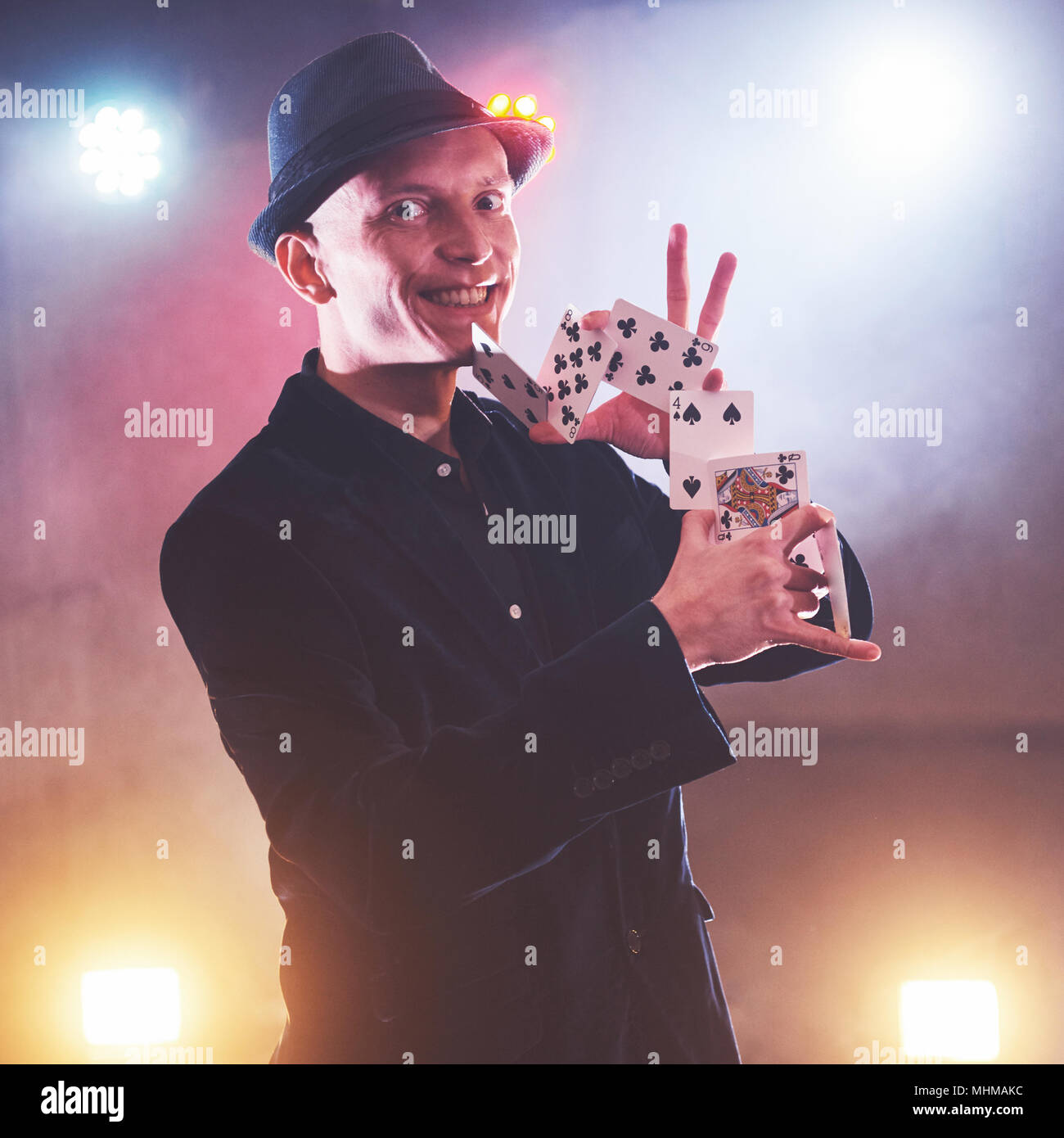 Magician showing trick with playing cards. Magic or dexterity, circus ...