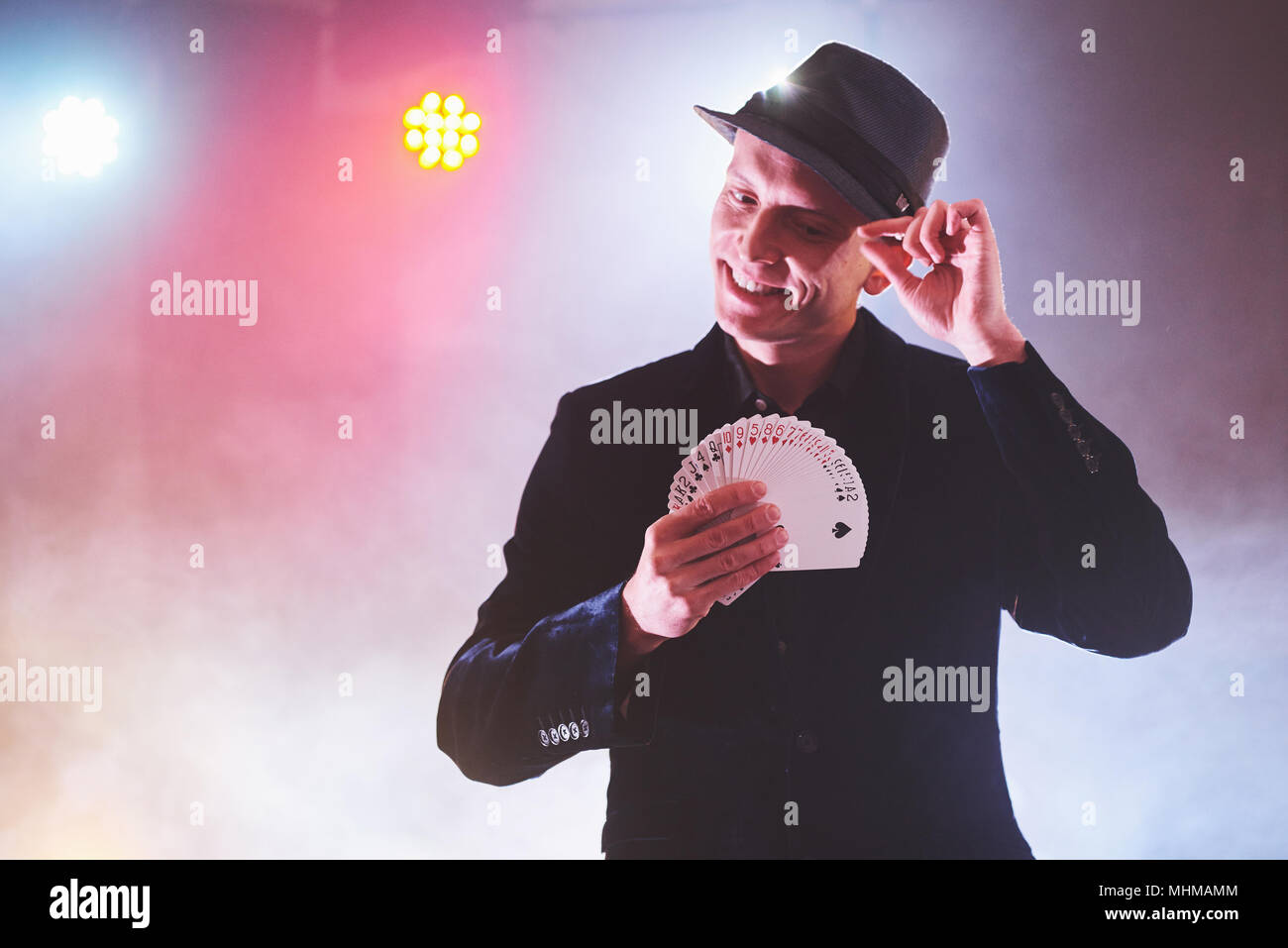Magician showing trick with playing cards. Magic or dexterity, circus ...