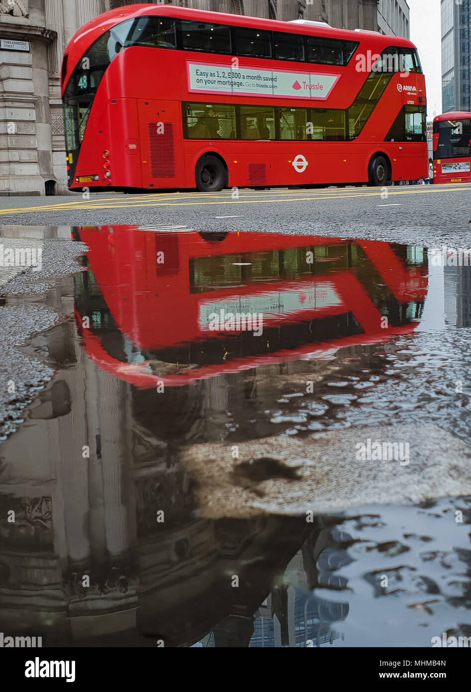 London bus puddle hi-res stock photography and images - Alamy