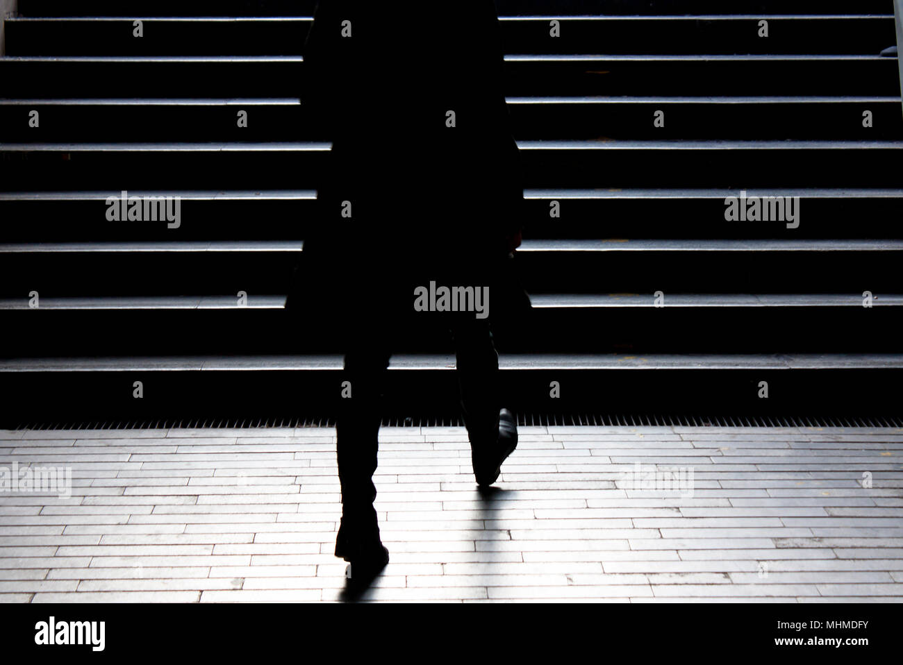Urban night walk : Blurry silhouette of young elegant independent woman ...