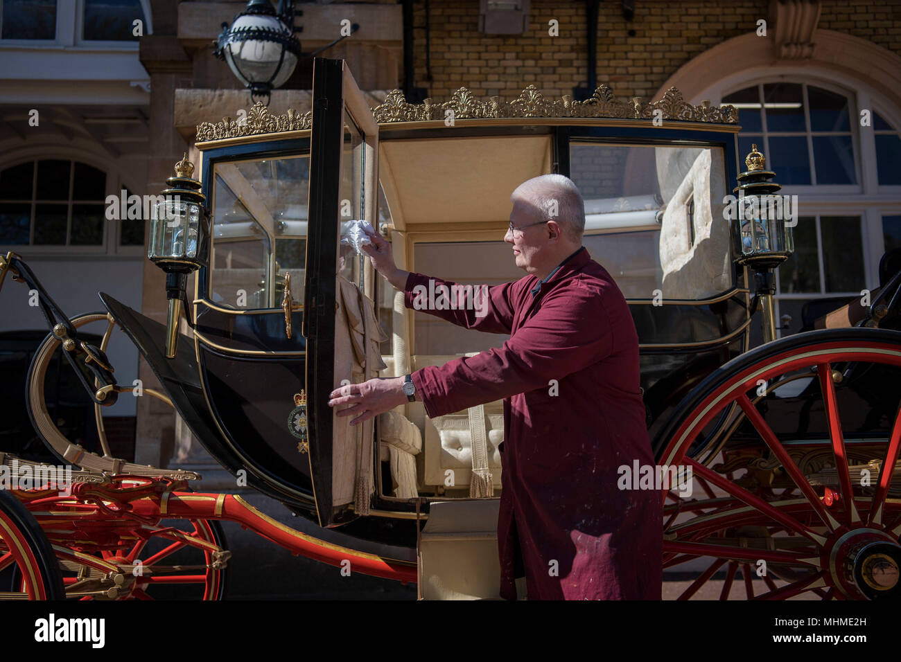 Martin Oates, Senior Carriage Restorer, polishes the Scottish State ...