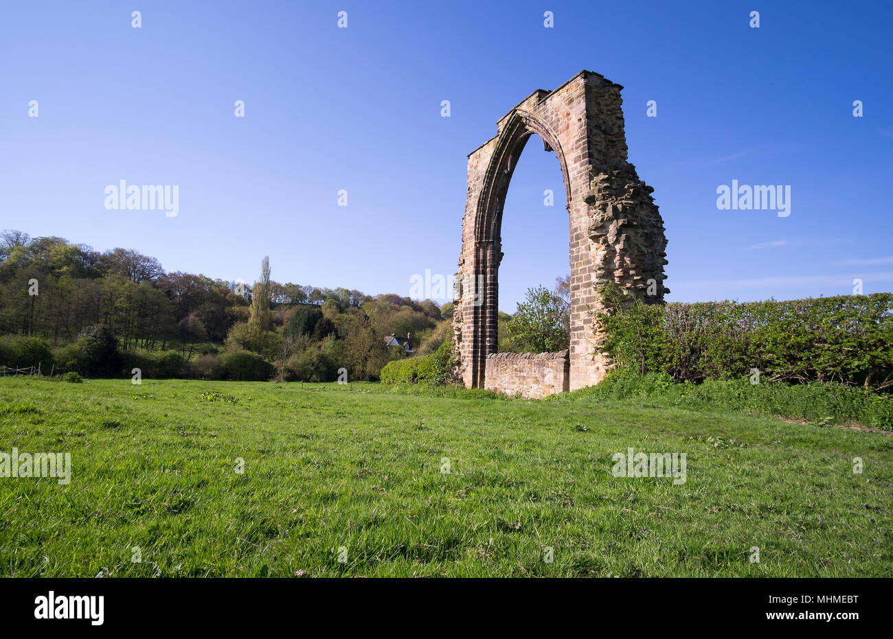 The ruined arched window frame at Dale Abbey, Derbyshire, UK Stock ...
