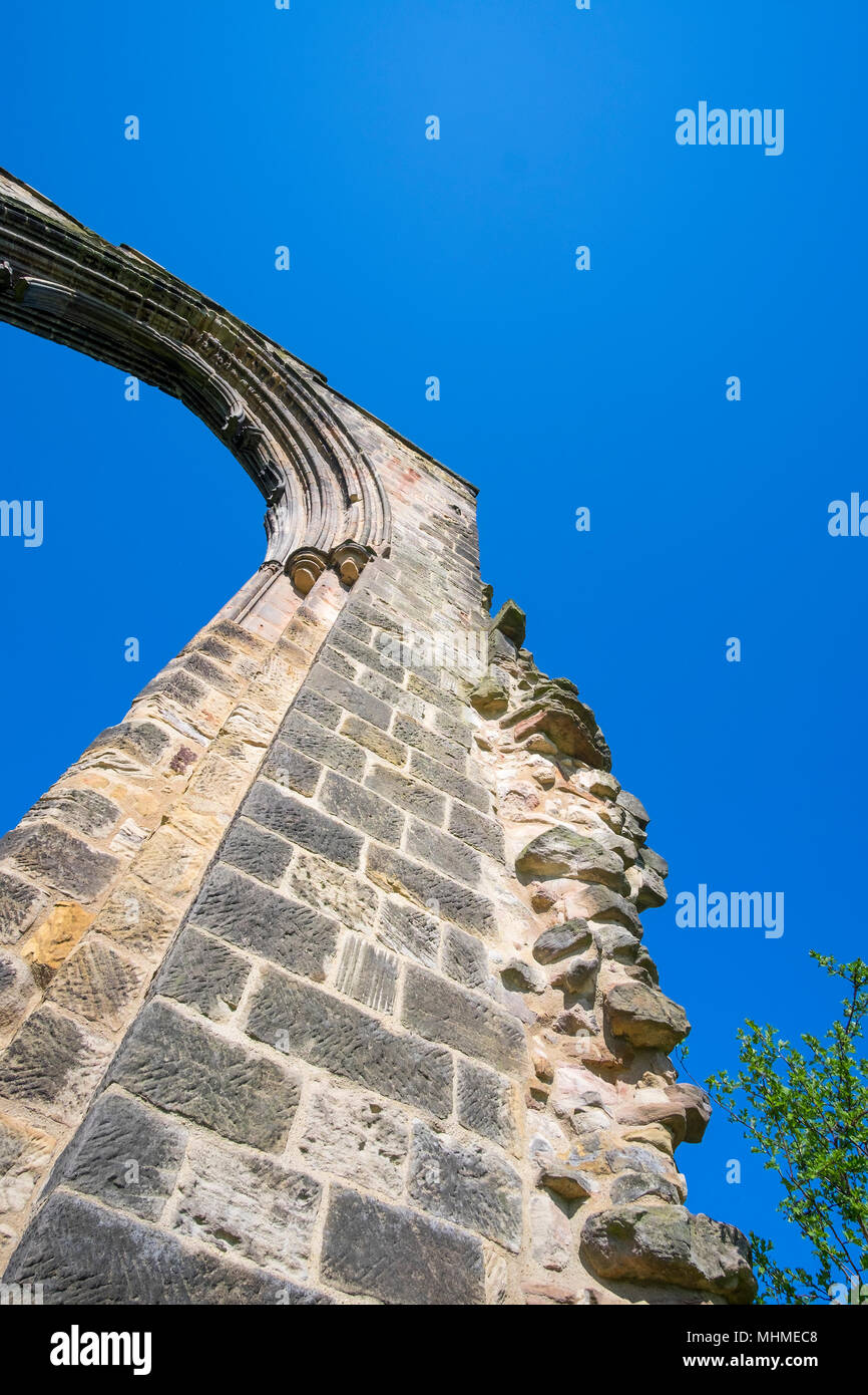 The ruined arched window frame at Dale Abbey, Derbyshire, UK Stock ...
