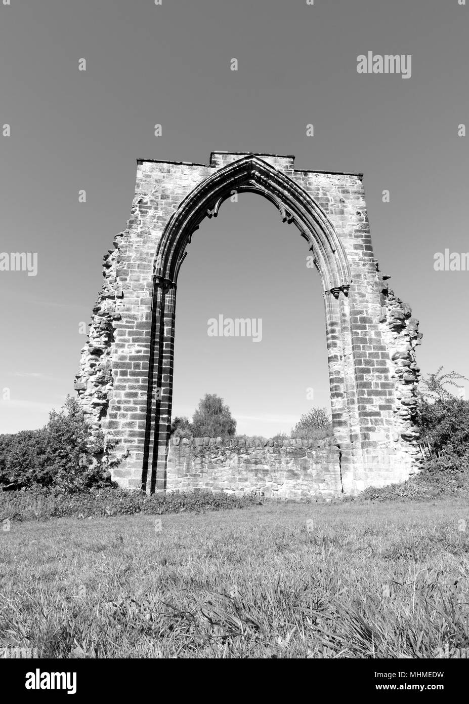 The ruined arched window frame at Dale Abbey, Derbyshire, UK Stock ...