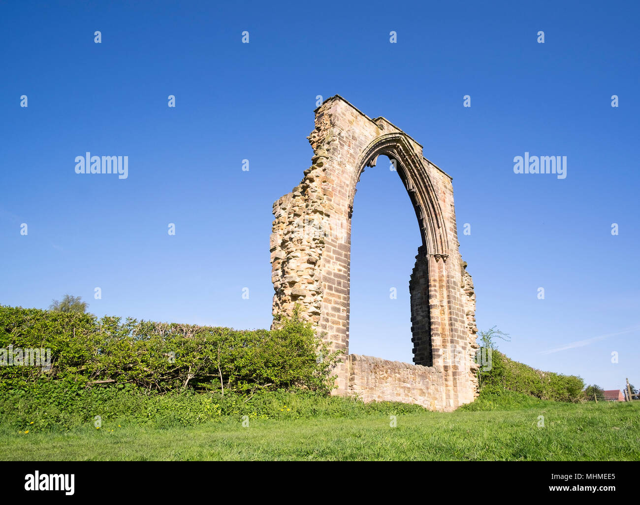 The ruined arched window frame at Dale Abbey, Derbyshire, UK Stock ...