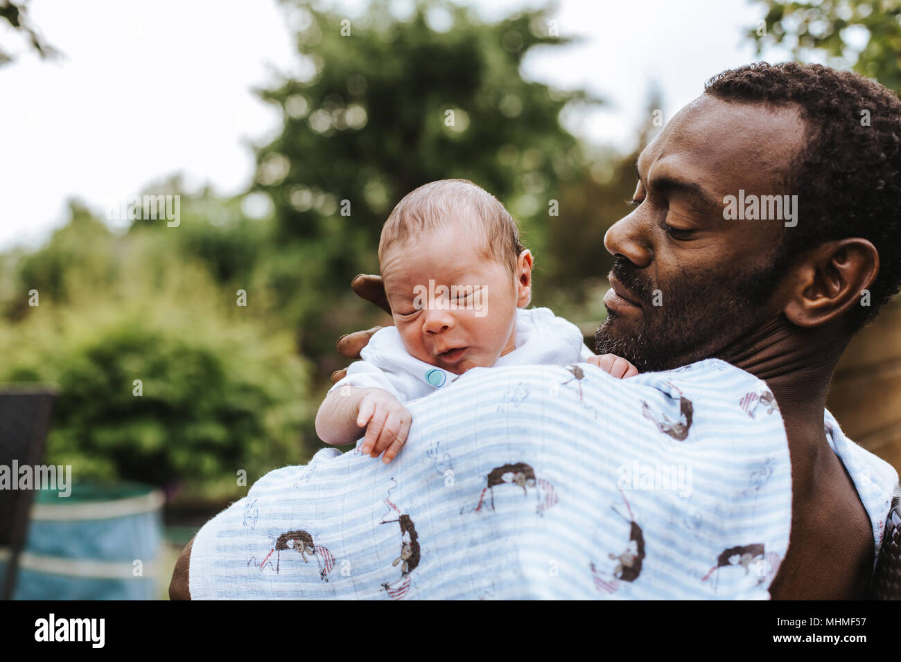Children observing baby hi-res stock photography and images - Alamy