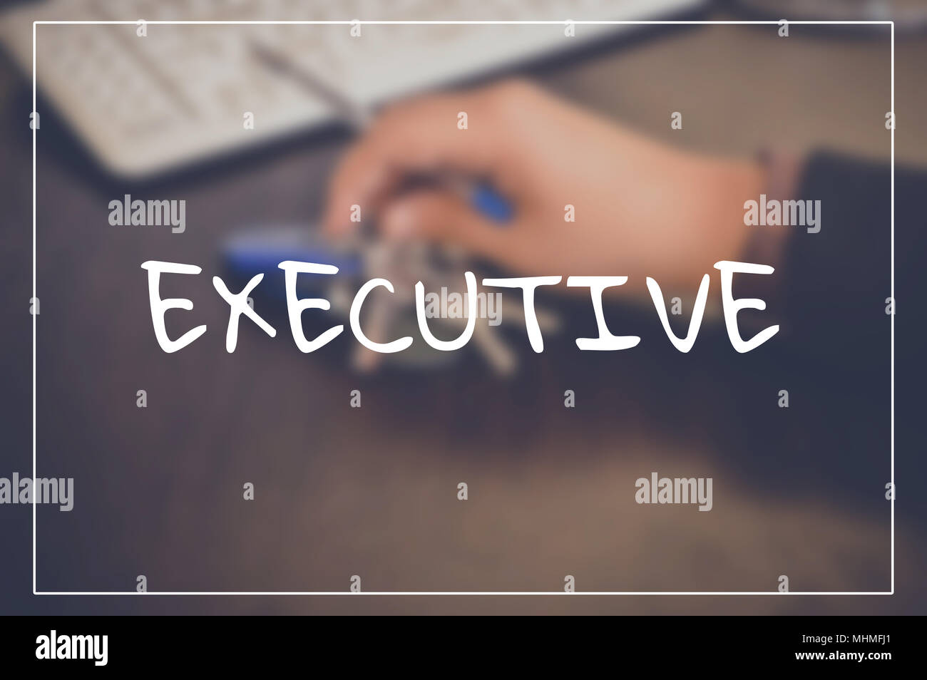 Executive word with business blurring background Stock Photo - Alamy