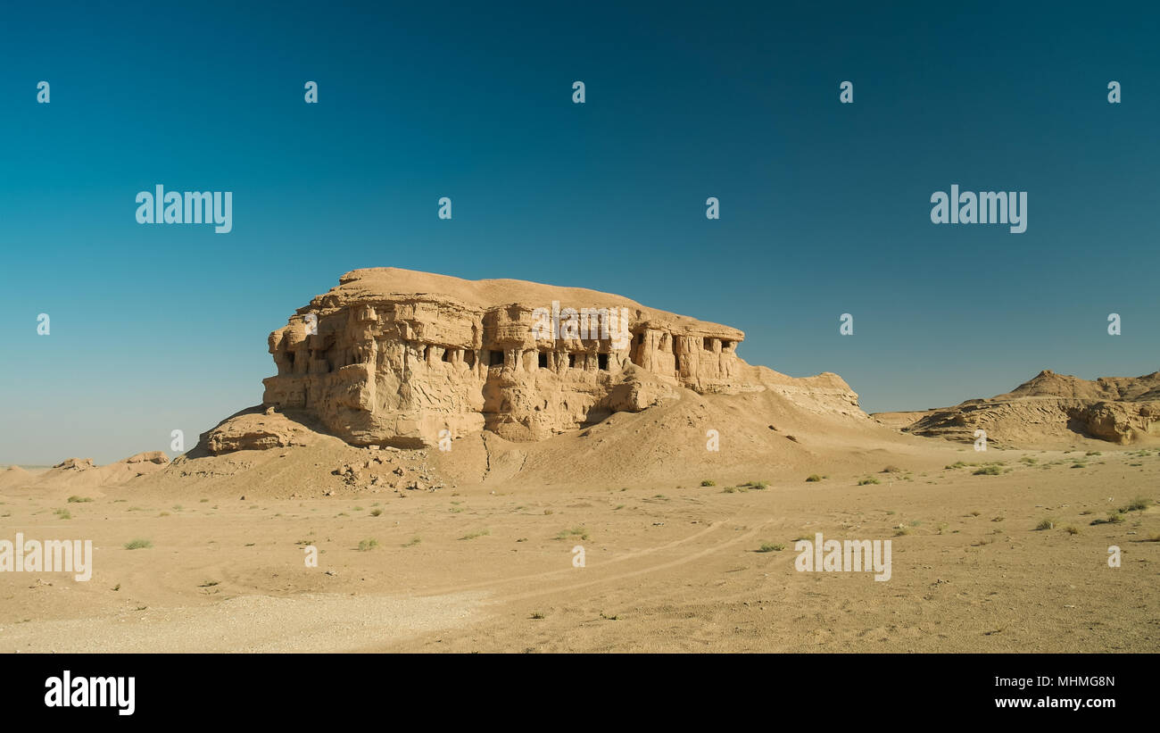Butte at the dried shore of Razazza lake aka Milh lake or Sea of Salt ...