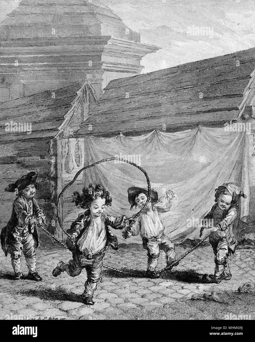 Boys skipping with a skipping rope Stock Photo - Alamy