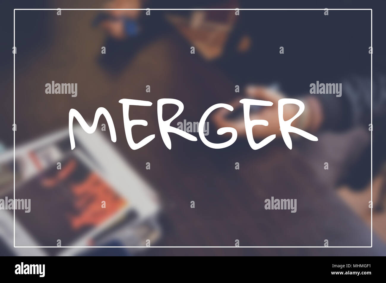 Merger word with business blurring background Stock Photo - Alamy