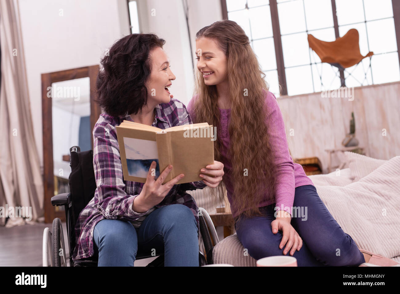 Disabled girl reading hi-res stock photography and images - Alamy