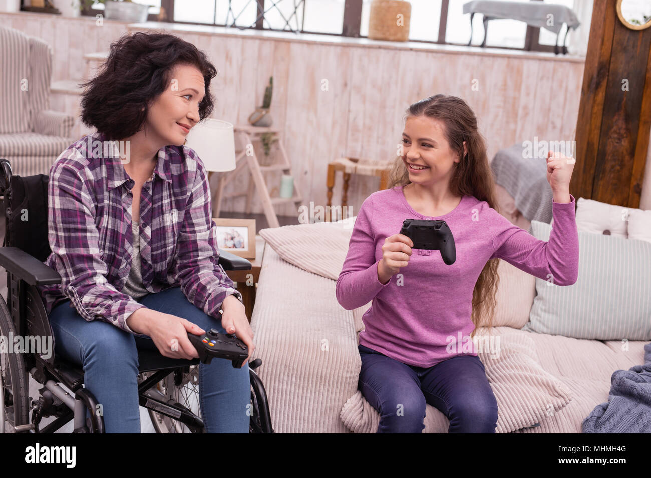 Gay girl challenging incapacitated woman in video games Stock Photo - Alamy