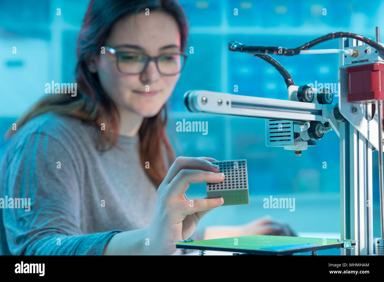 young woman design printing of the metamaterials on a 3D printer Stock ...