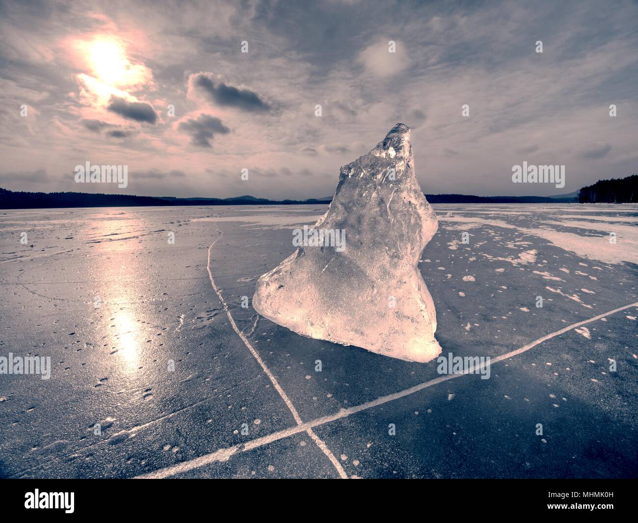Broken piece of ice with sharp cracks inside. Abstract ice floe. Nature ...