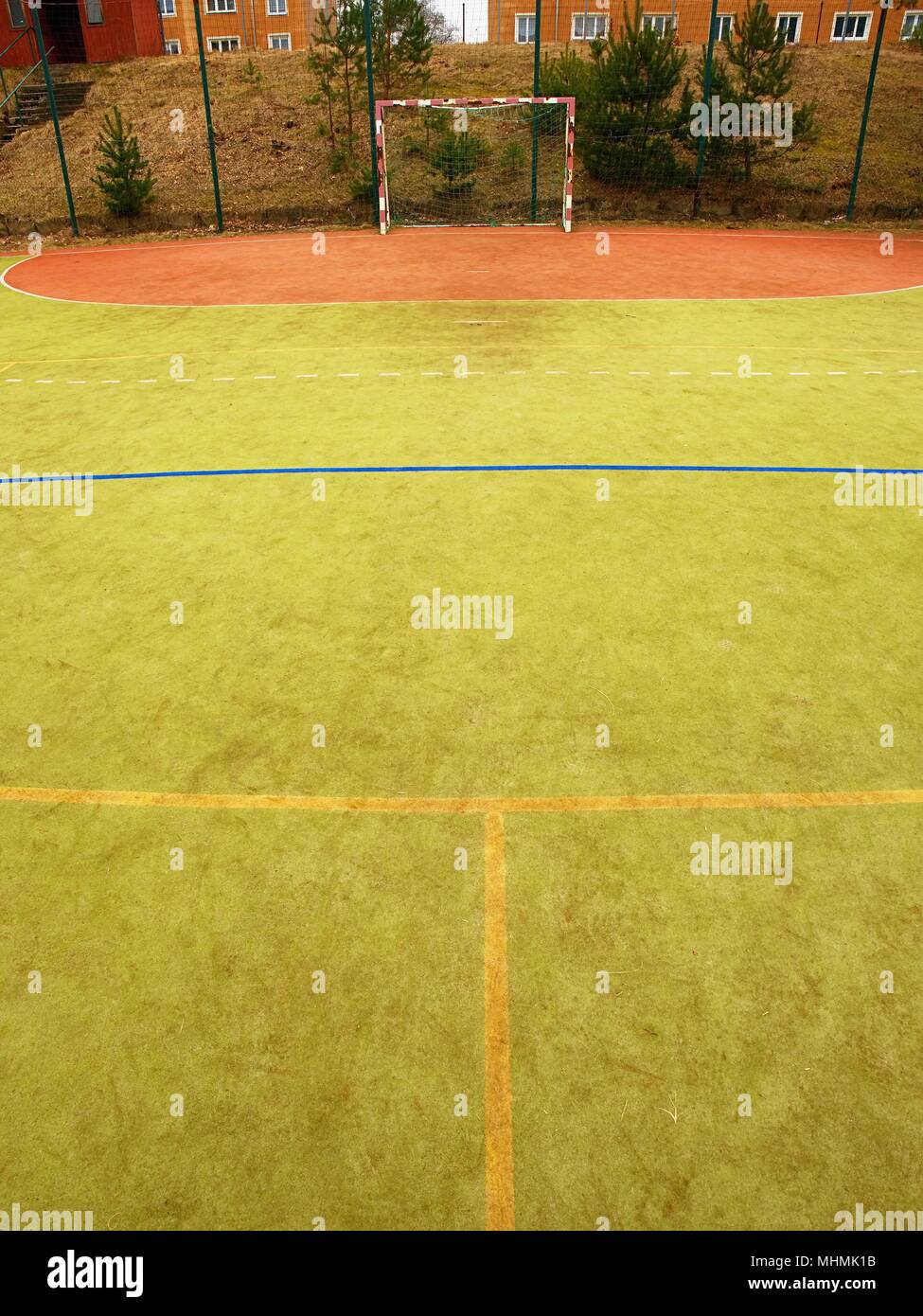 Empty gate. Outdoor football or handball playground plastic light green ...