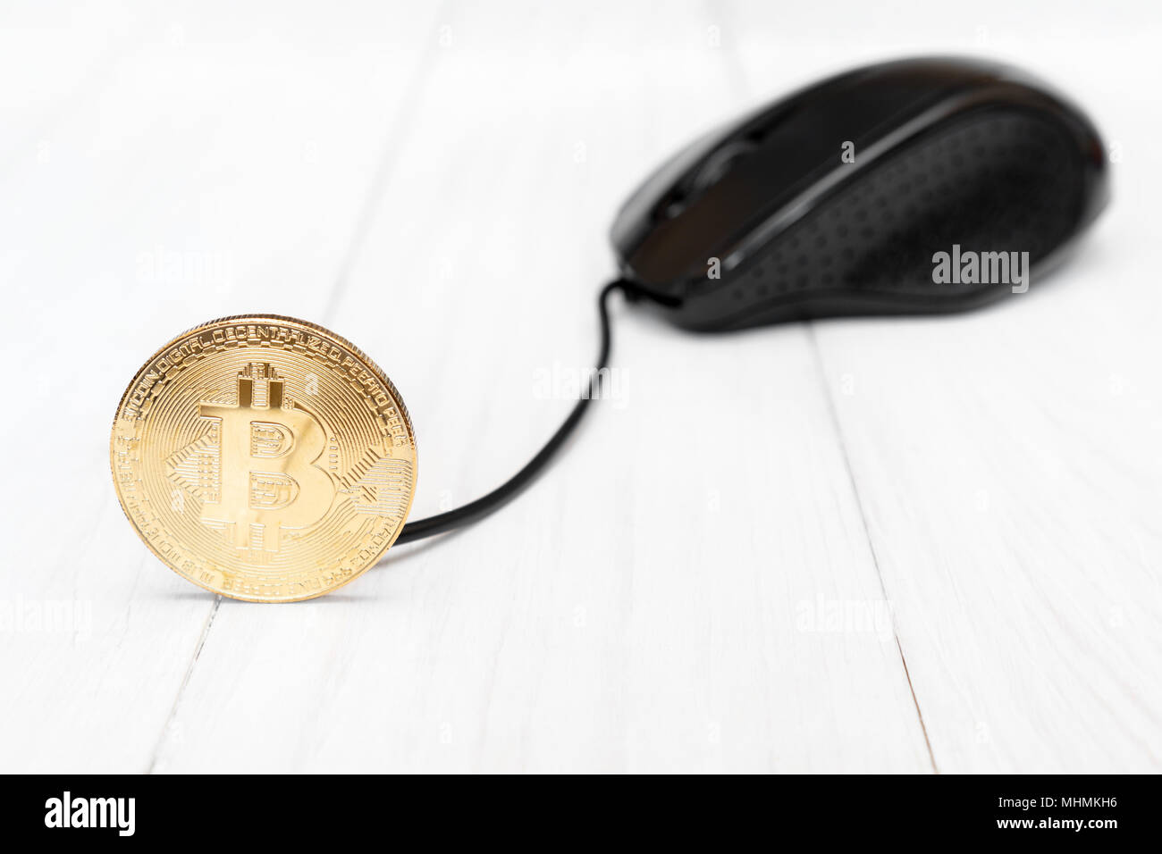 Bitcoin connected with computer mouse. Cryptocurrency mining concept ...