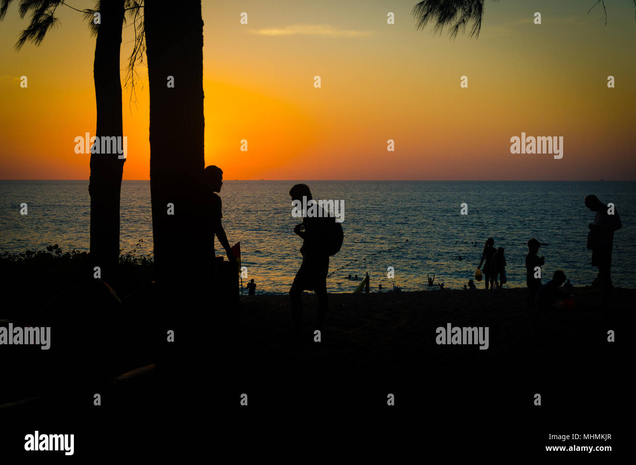 People and family enjoying sunset at the beach Stock Photo - Alamy