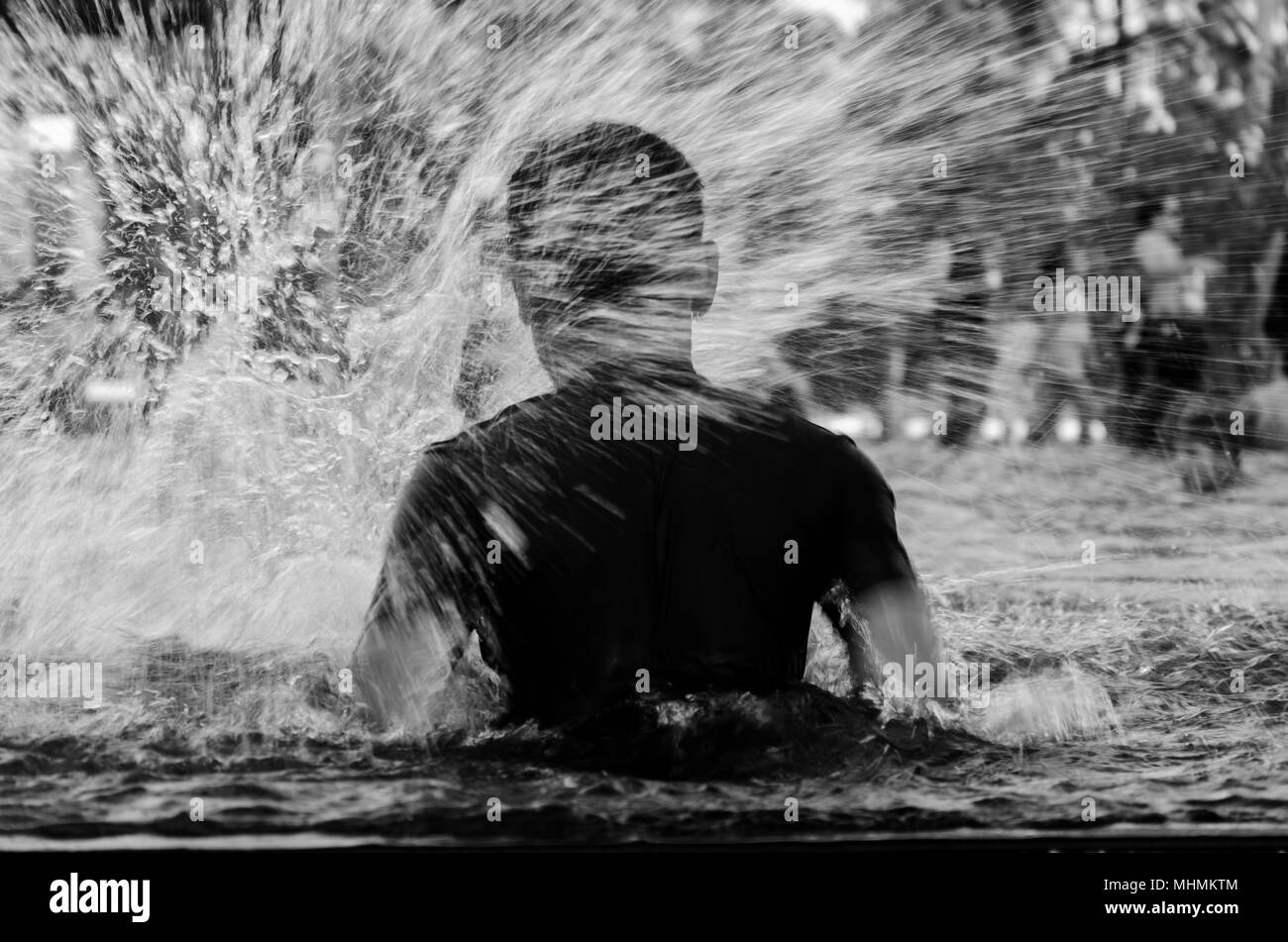 Water splash in swimming pool Stock Photo - Alamy