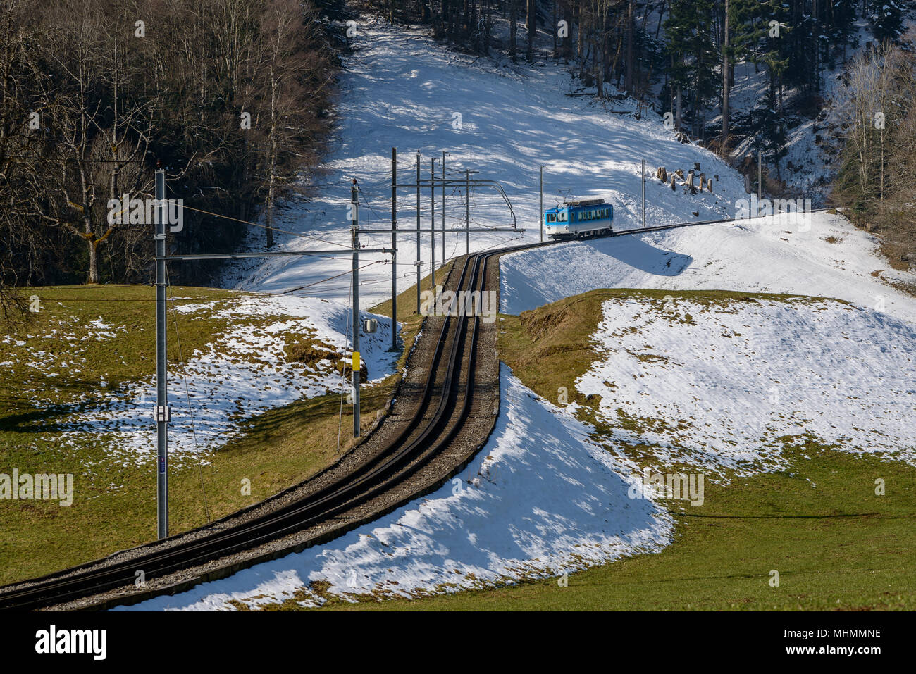 Rigibahn railway cogwheel train carriage descends downhill approaching ...
