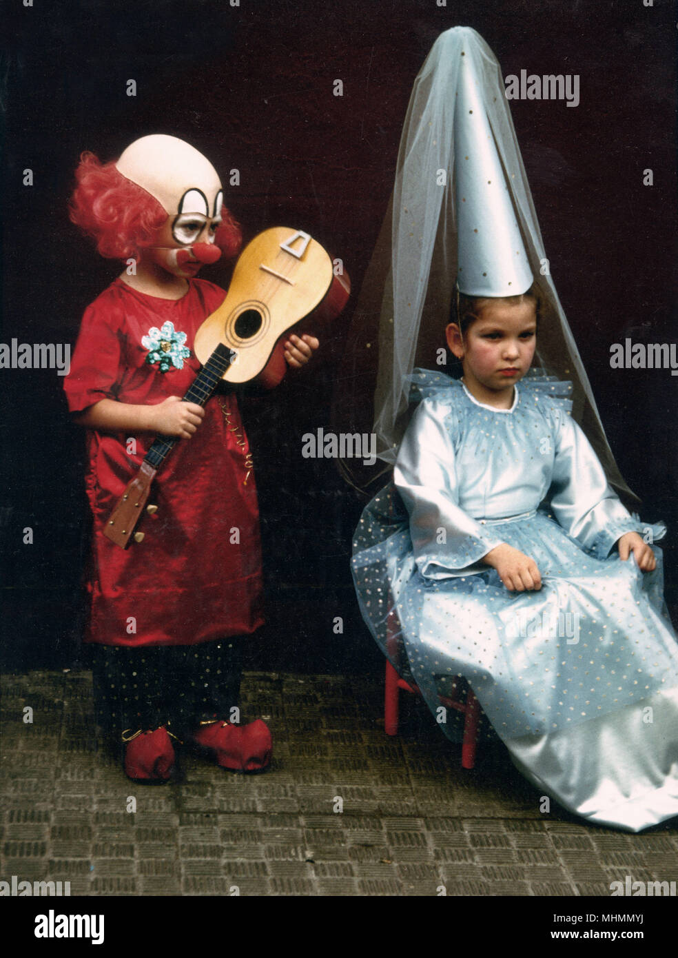 Children in fancy dress - clown and princess Stock Photo - Alamy
