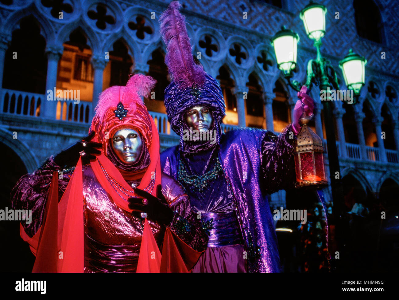 Venice, Italy; couple in fancy dress at Venice Carnival. Held in ...
