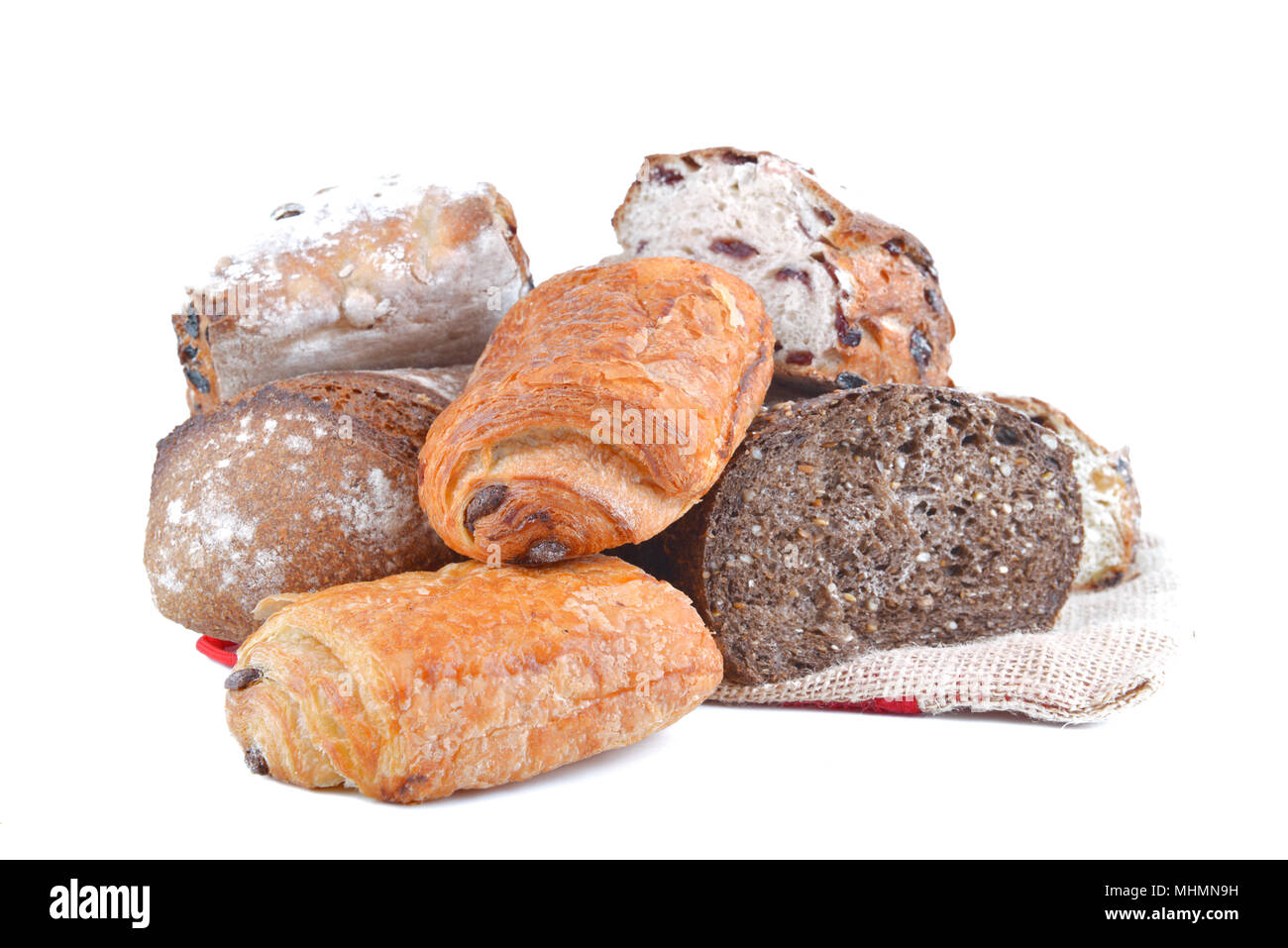 group of different variety of bread and pastry on white background ...