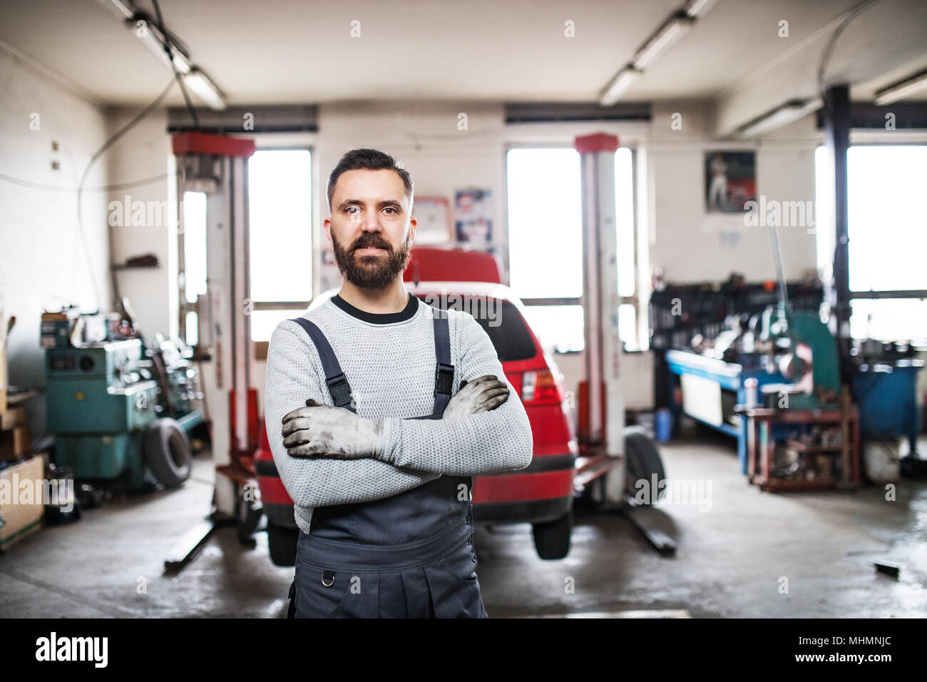 Mechanic standing in garage hi-res stock photography and images - Alamy