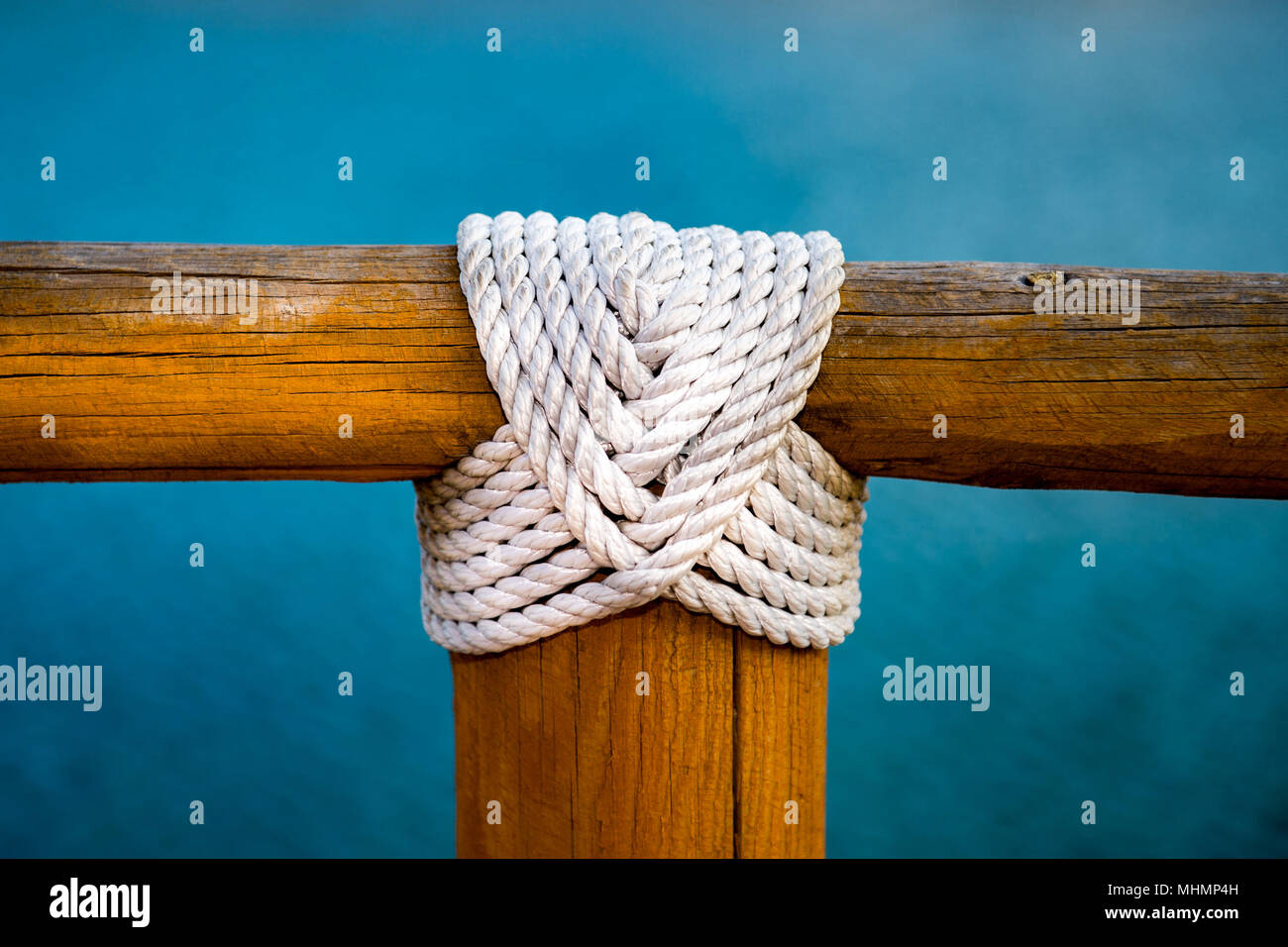Old rope tied wooden pole hi-res stock photography and images - Alamy