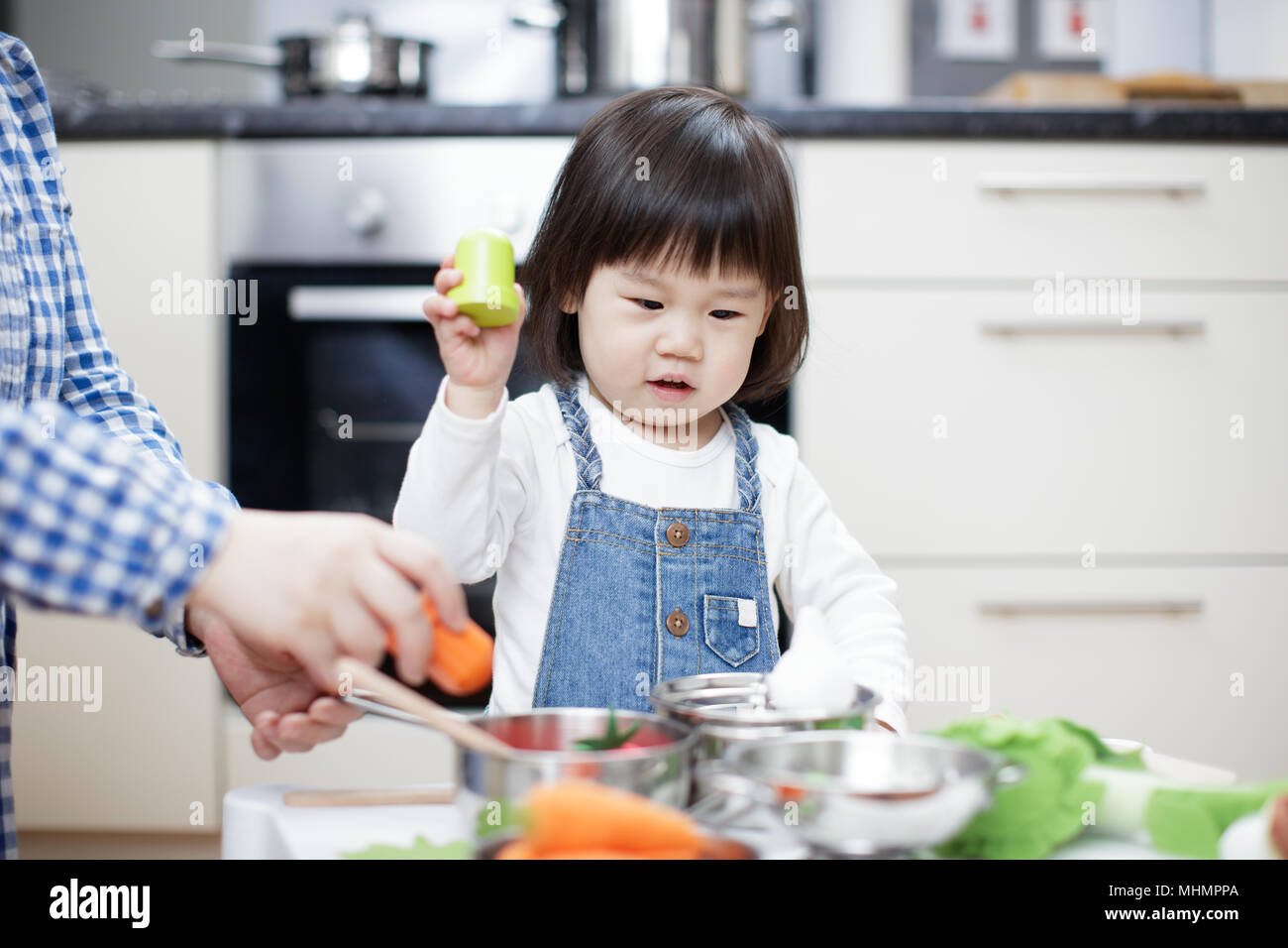 baby girl pretend play food toy Stock Photo - Alamy