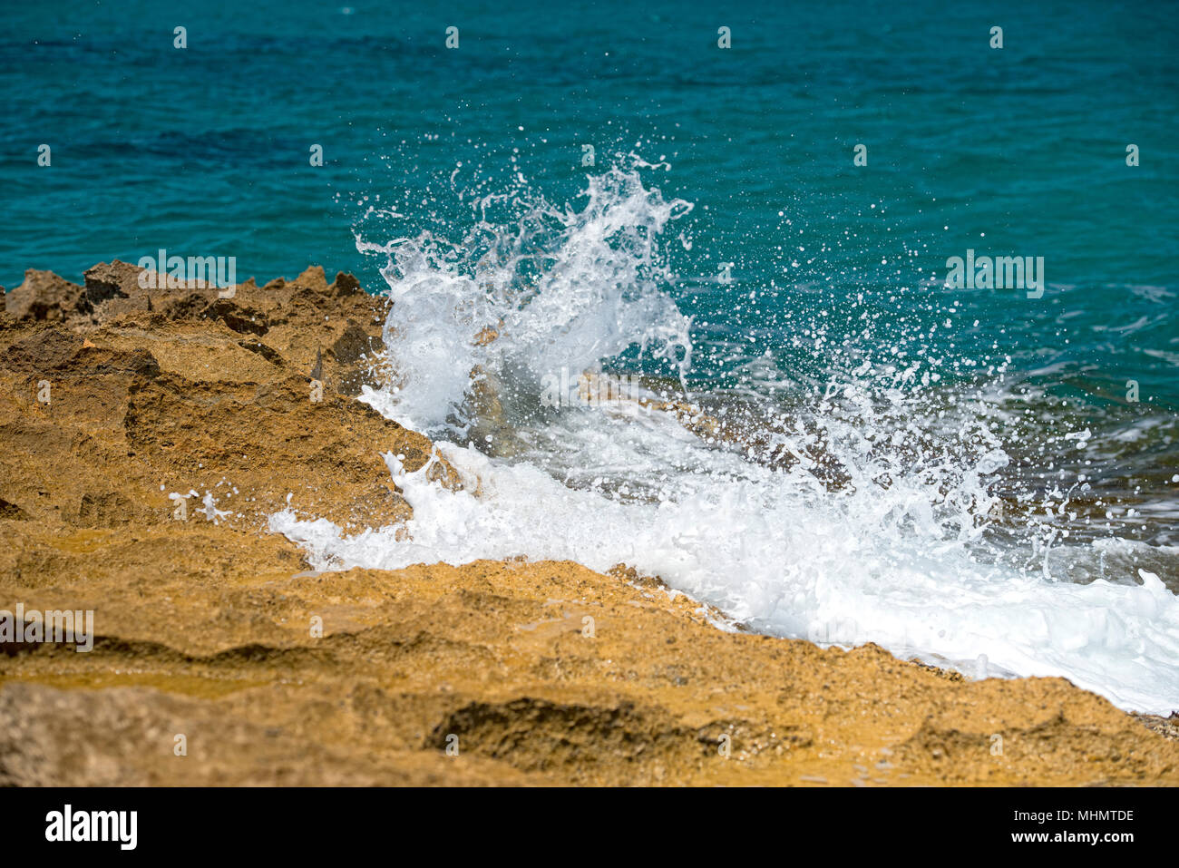 sea waves on lava rocks shore Stock Photo - Alamy