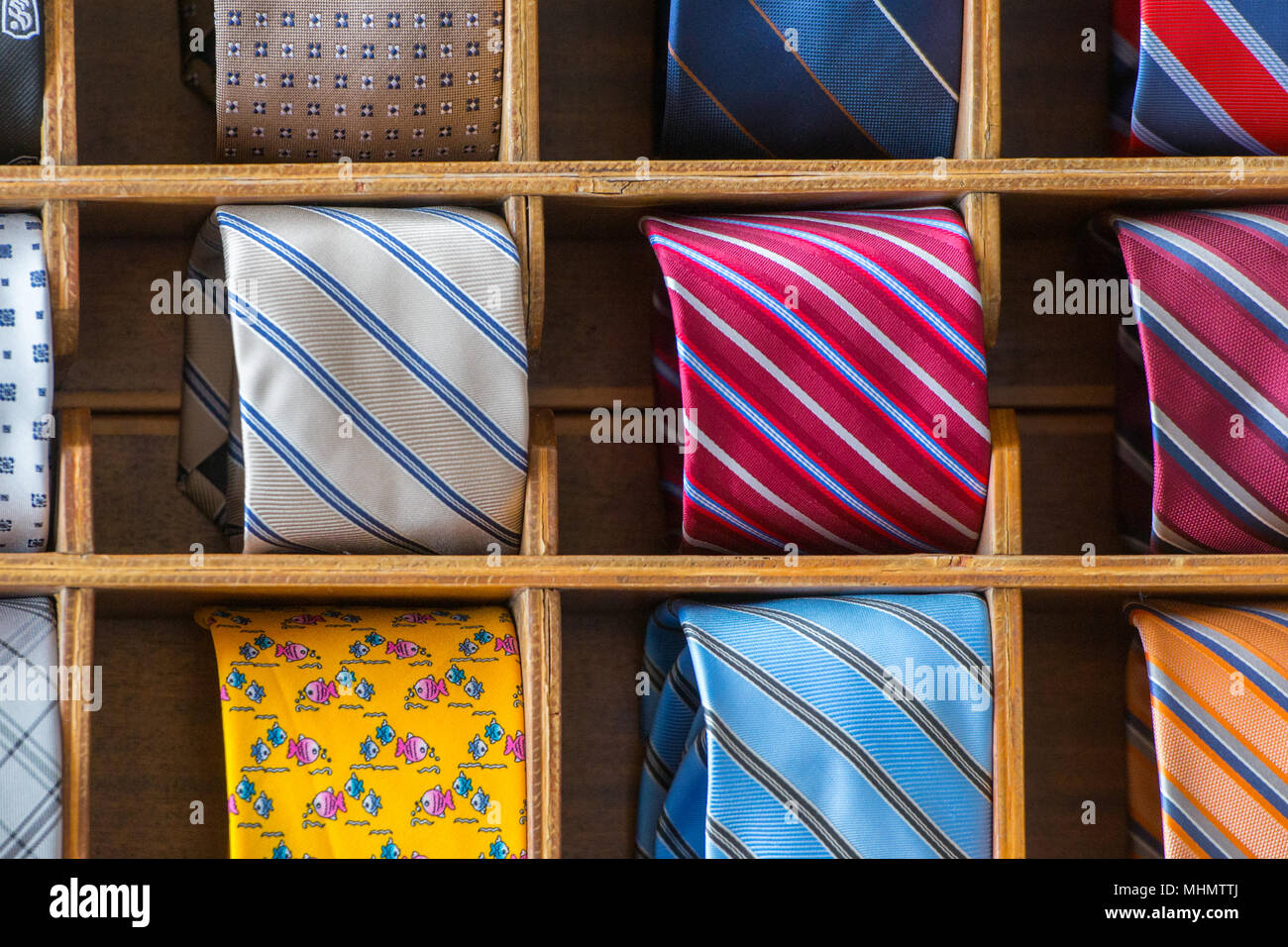 different colors silk tie on display stand Stock Photo - Alamy