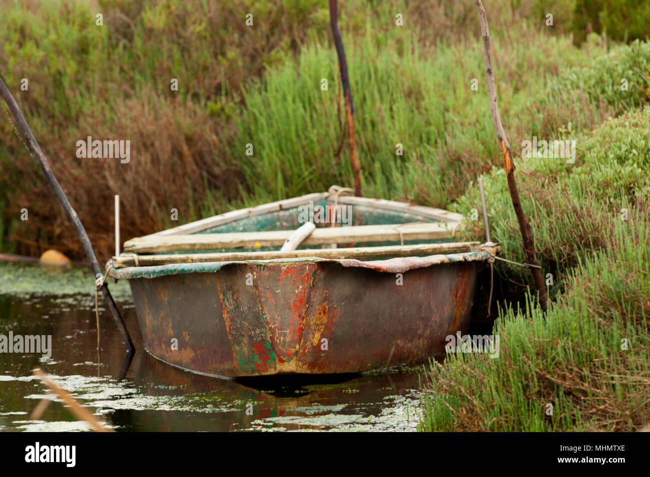An old fishing boat in swamp in Sardinia, Italy Stock Photo - Alamy