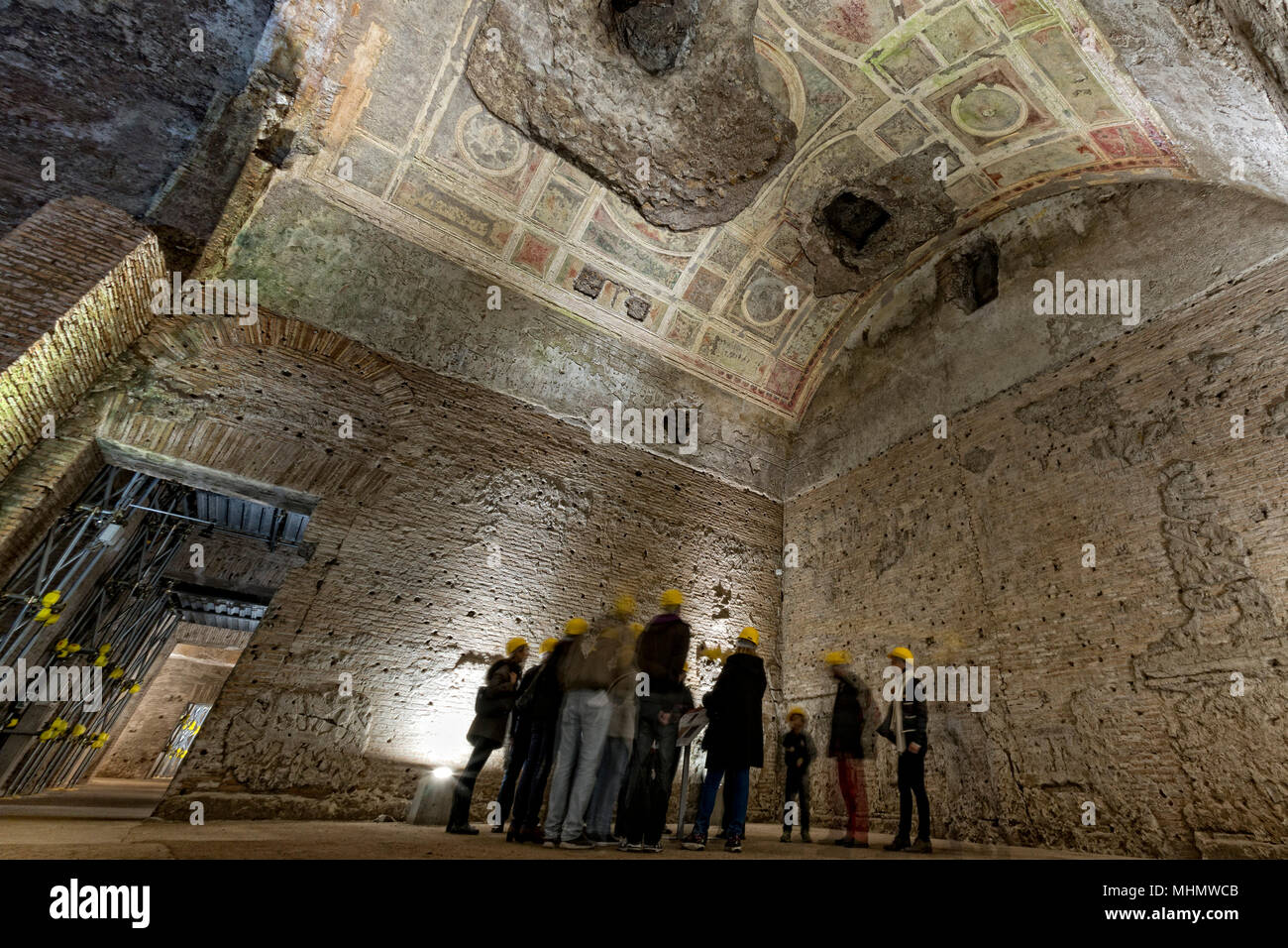 people exploring antique roman ruins being restored Stock Photo - Alamy