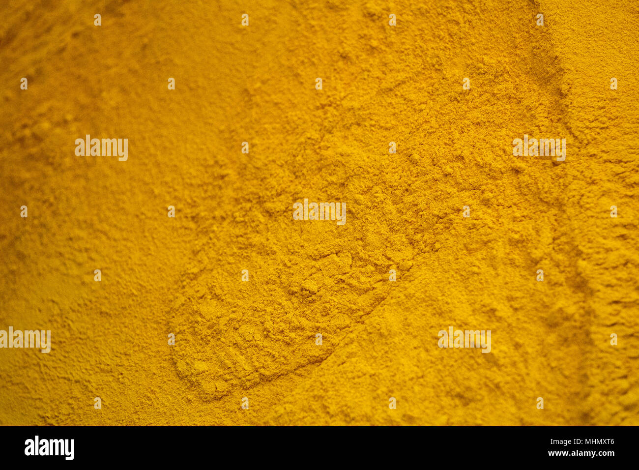 turmeric powder background yellow detail texture close up Stock Photo ...