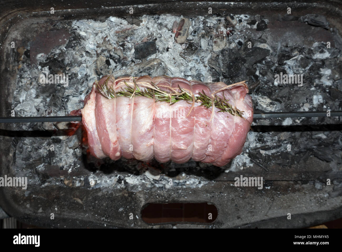 veal roast while cooking on charcoal barbecue grill Stock Photo - Alamy